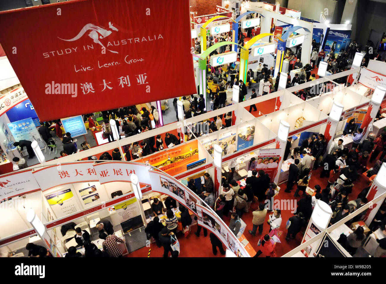 --FILE--Visitors crowd booths in the exhibition area for Study in ...
