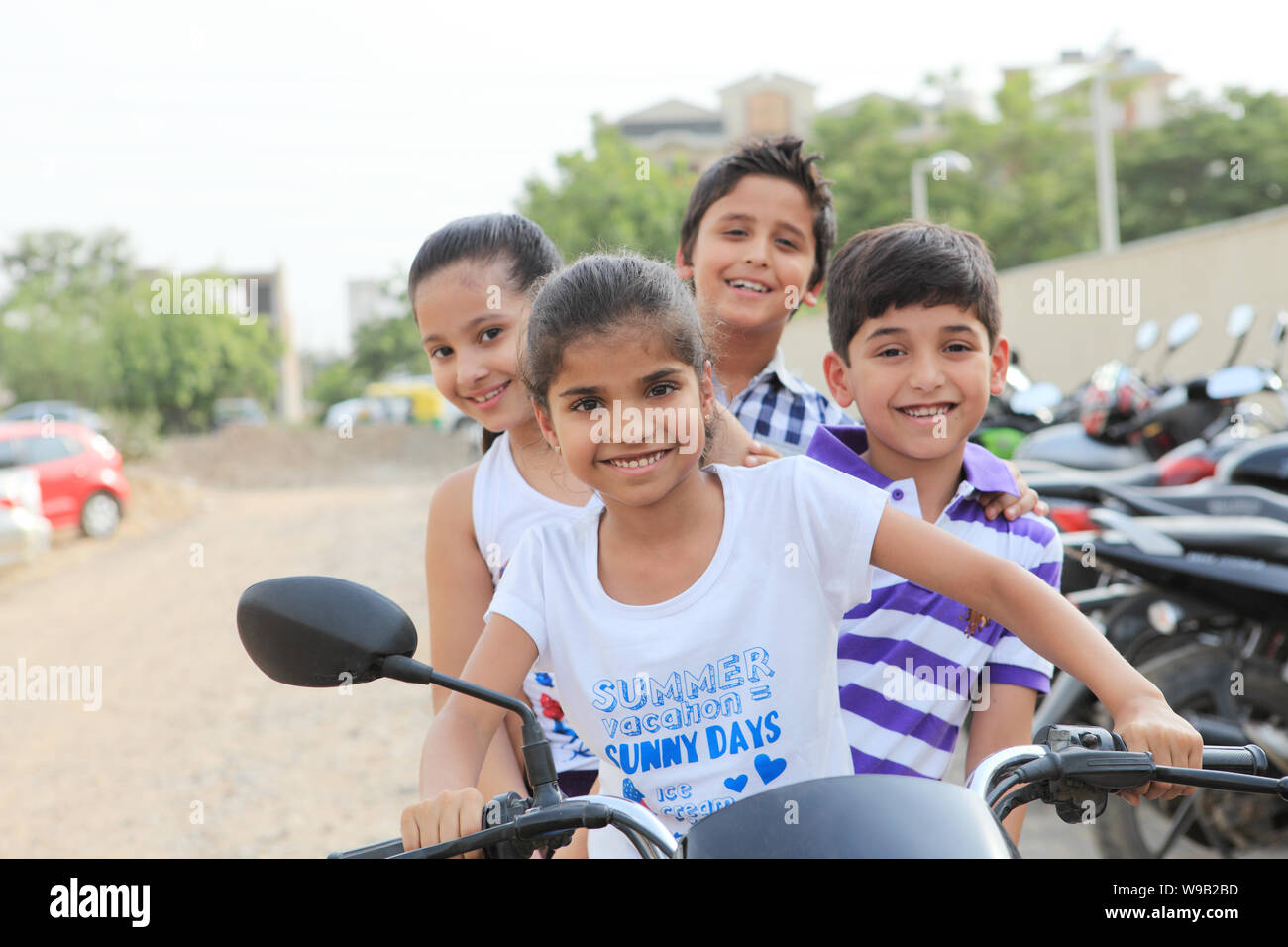 Group of children on motorcycle Stock Photo - Alamy