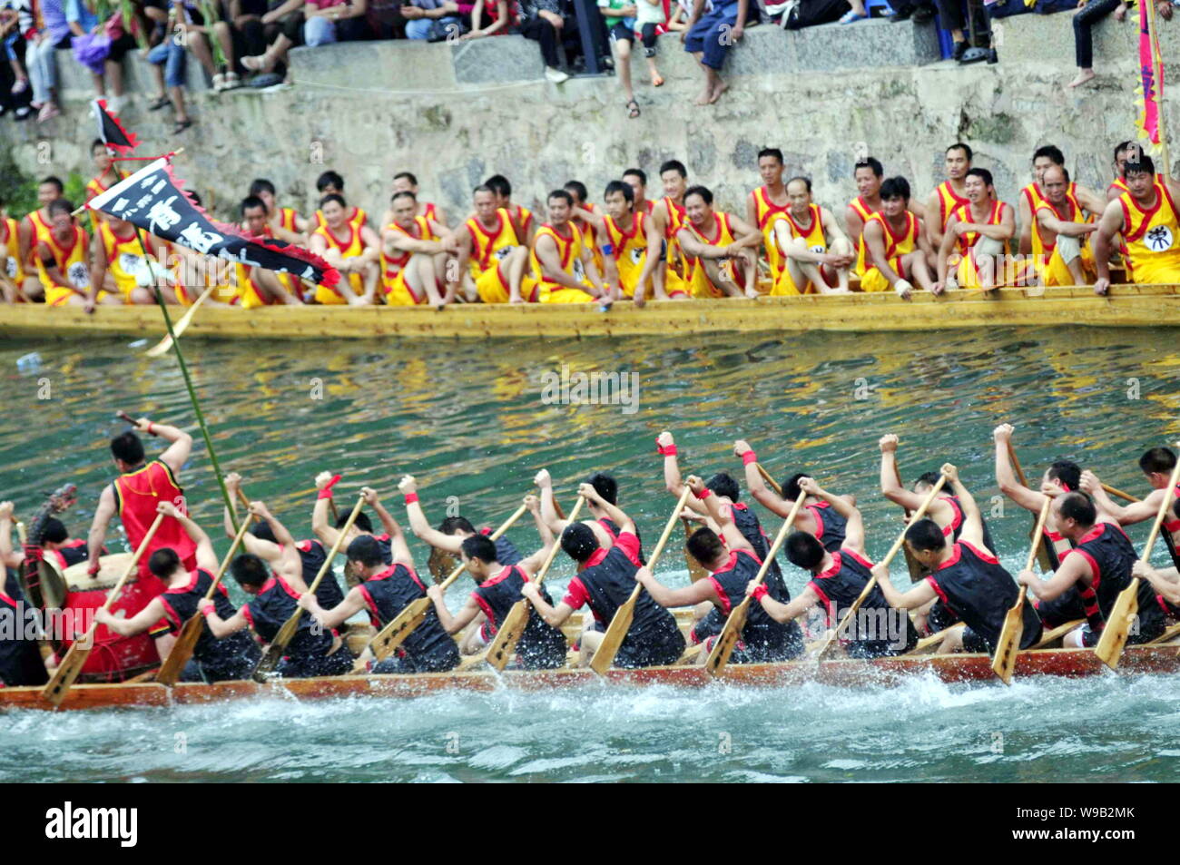 Chinese participants compete during a dragon boat racing to celebrate ...