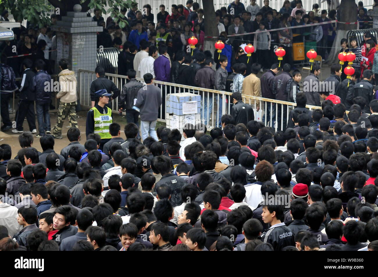 Crowds of job seekers queue up to apply for jobs during a recruitment ...