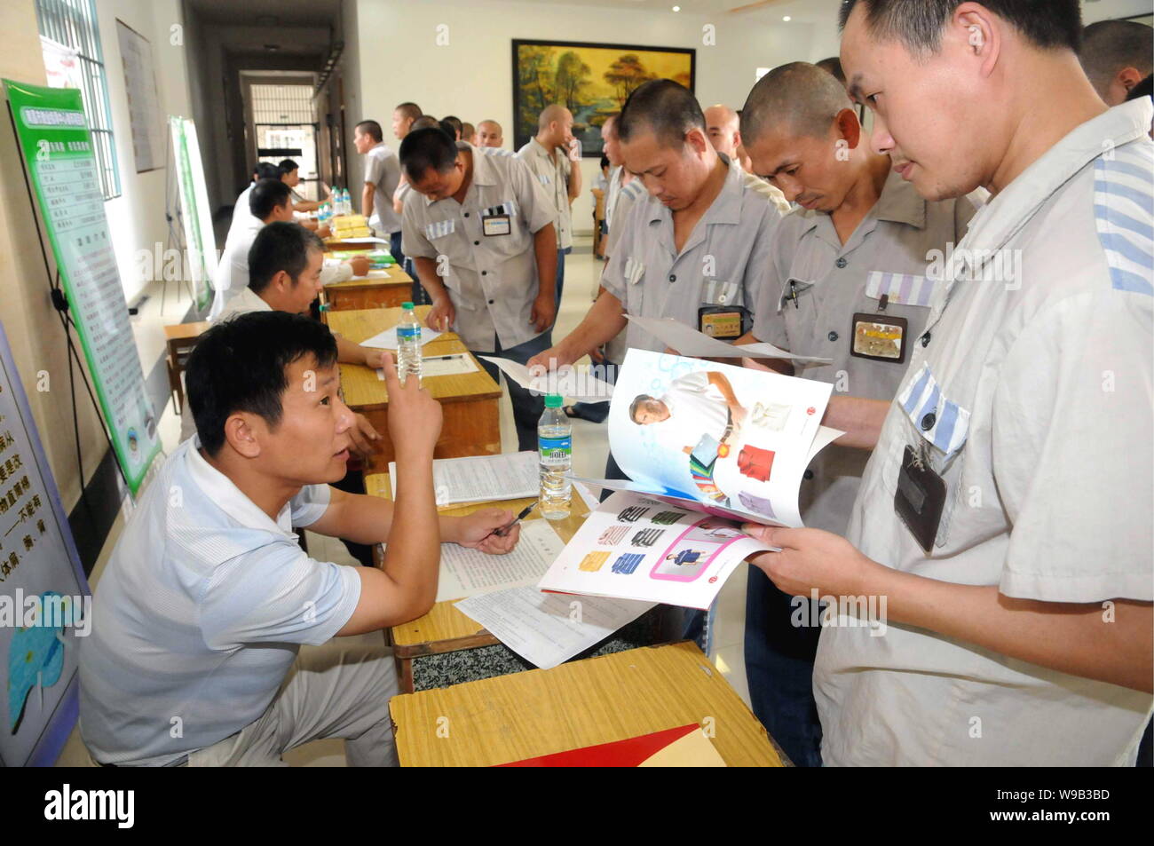 Chinese male inmates who will complete their term of imprisonment crowd ...