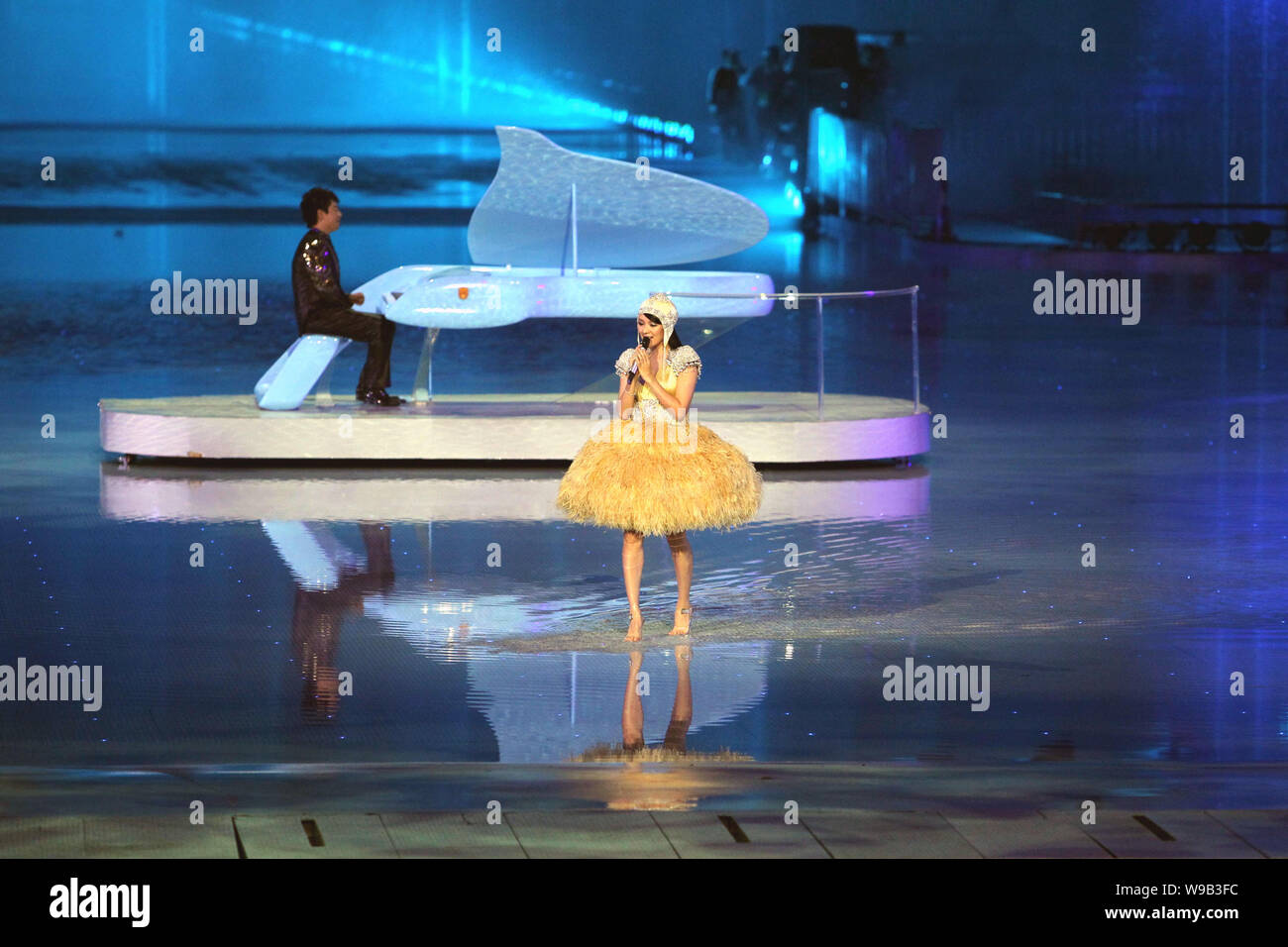 Chinese actress Zhang Ziyi performs next to Chinese pianist Lang Lang ...