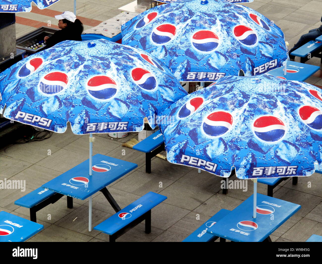 View of Pepsi beach umbrellas on a shopping street in Jilin city ...