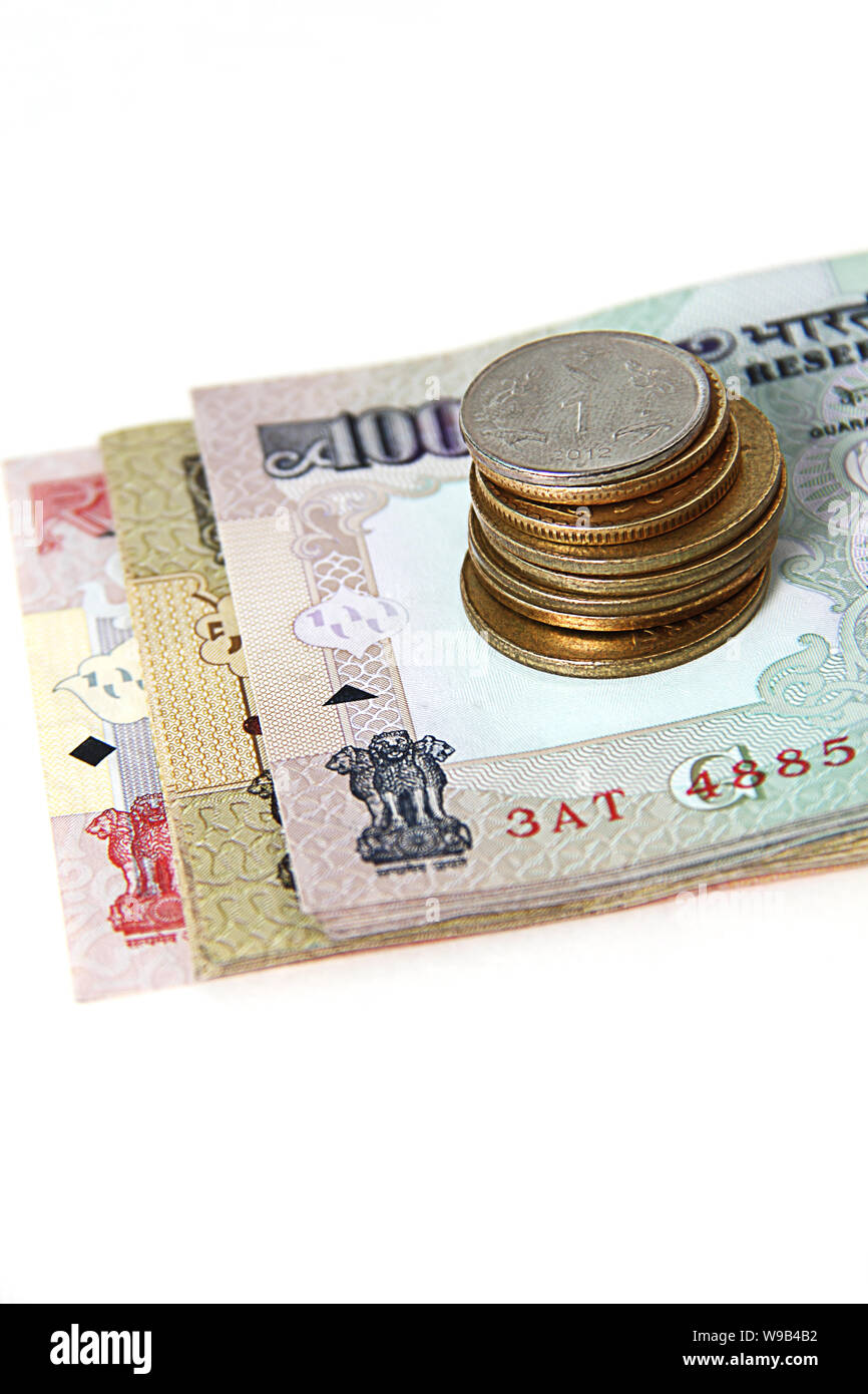 Stack of coins on Indian Banknotes Stock Photo - Alamy
