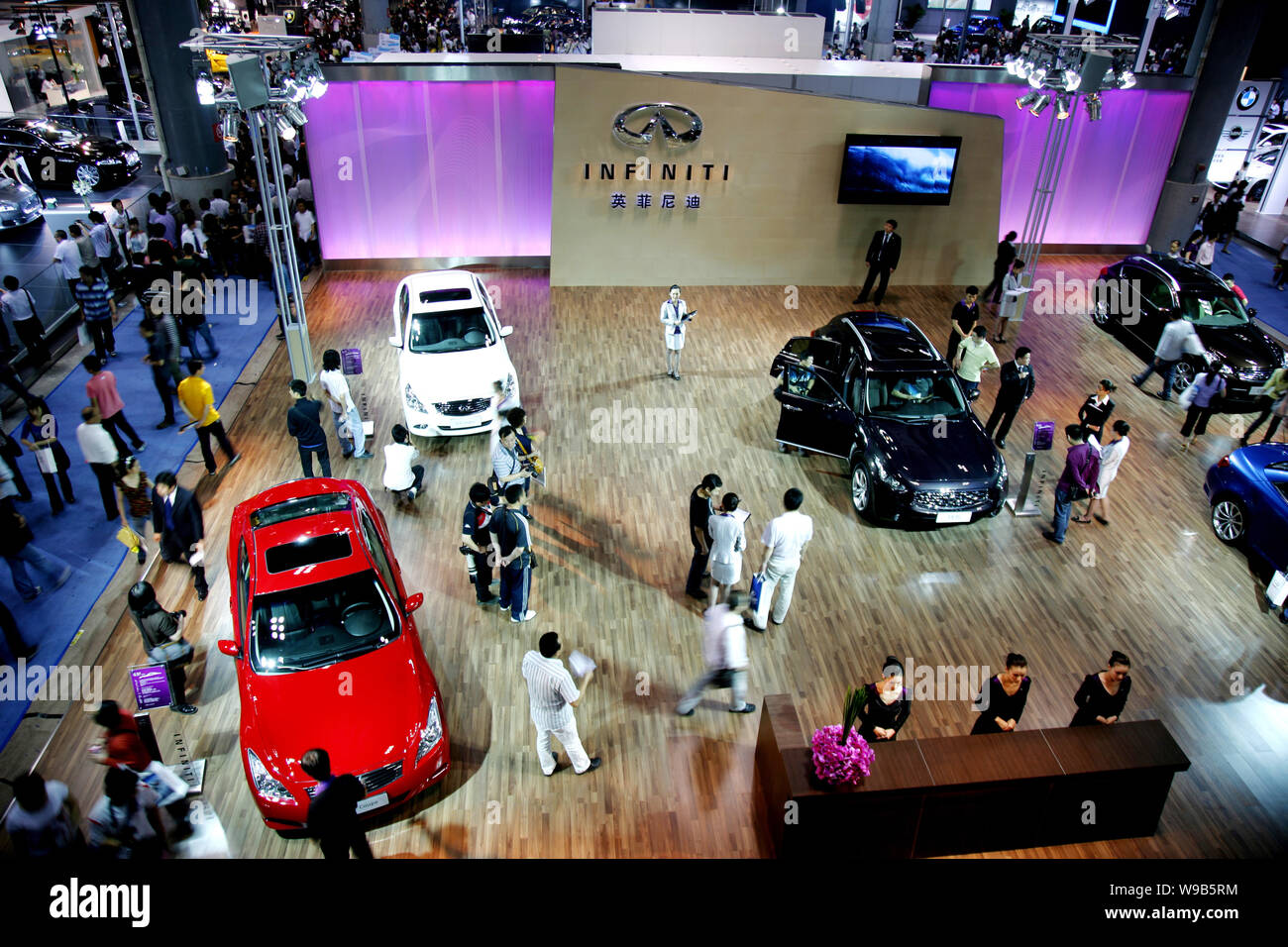 --FILE--Chinese visitors look at Infiniti cars of Nissan during an auto ...