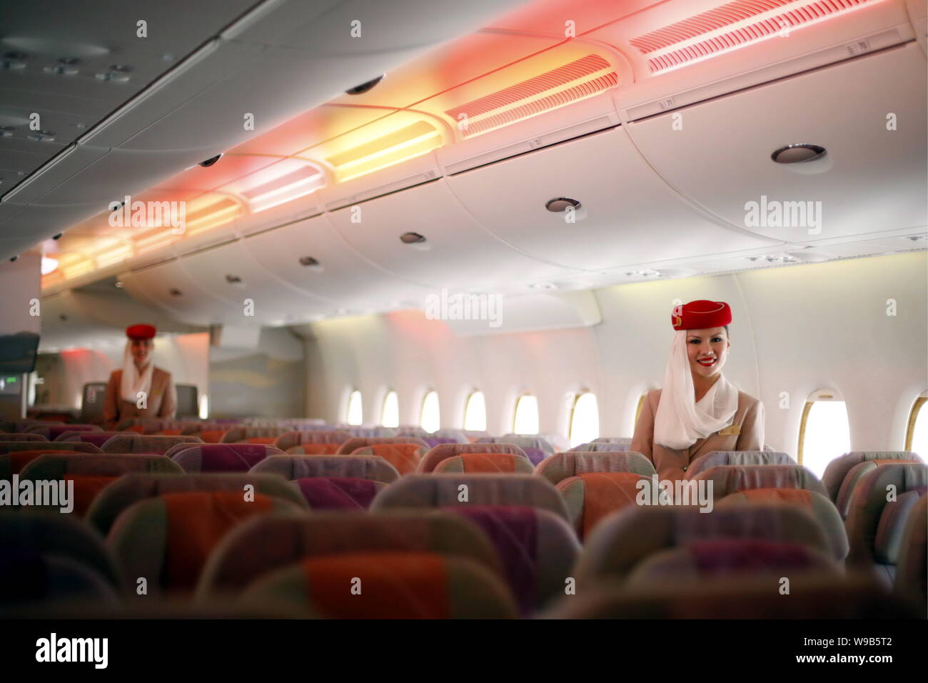 Emirates air hostess are seen in an Airbus A380 at Beijing Capital ...