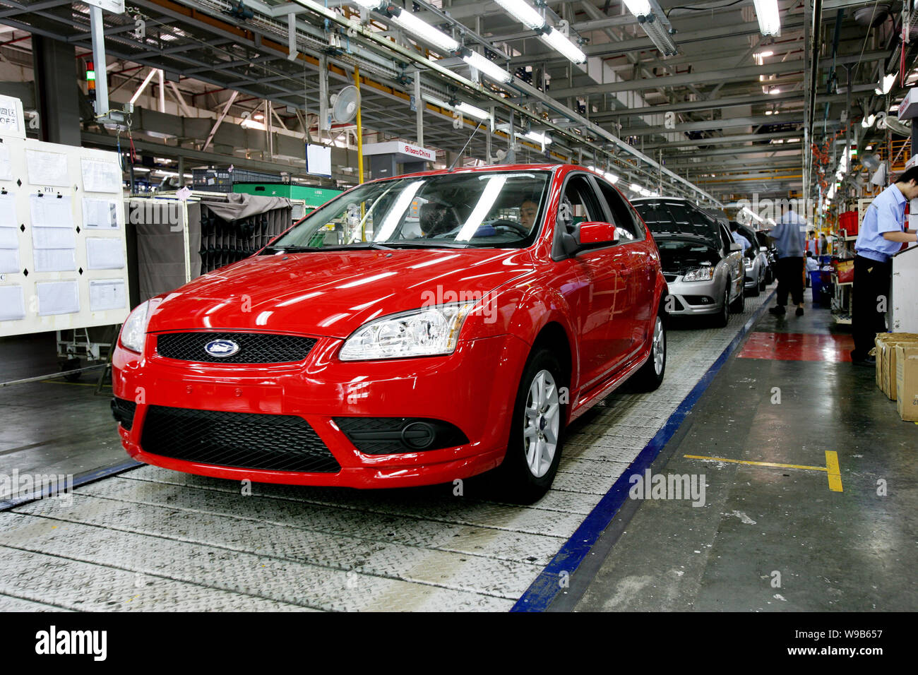 --FILE--Ford Focus cars pass through the assembly line in the auto ...