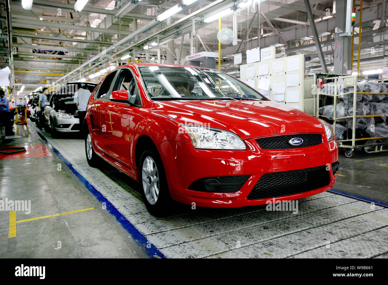 --FILE--Ford Focus cars pass through the assembly line in the auto ...