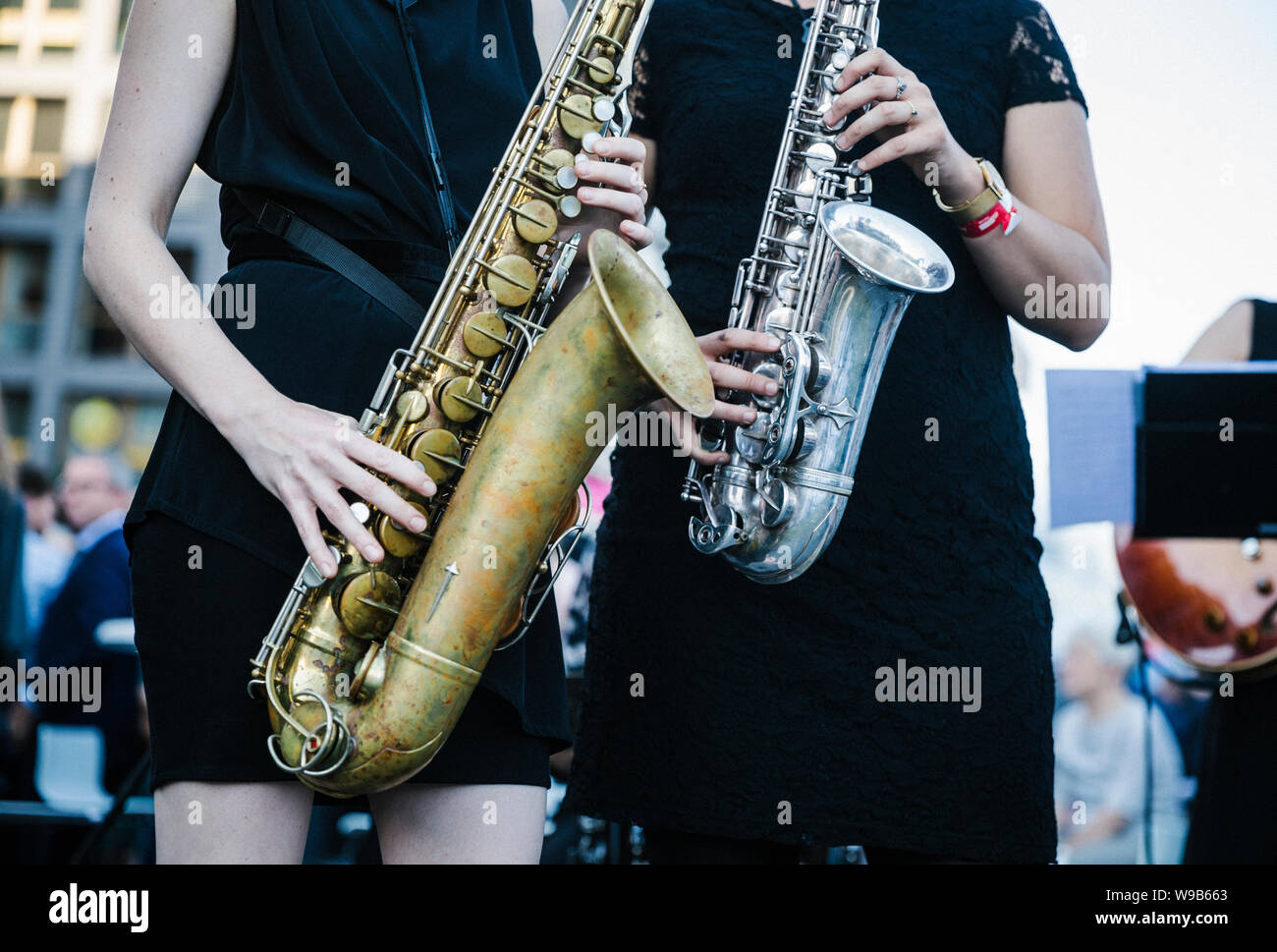 Woman outside playing a saxophone hi-res stock photography and images ...