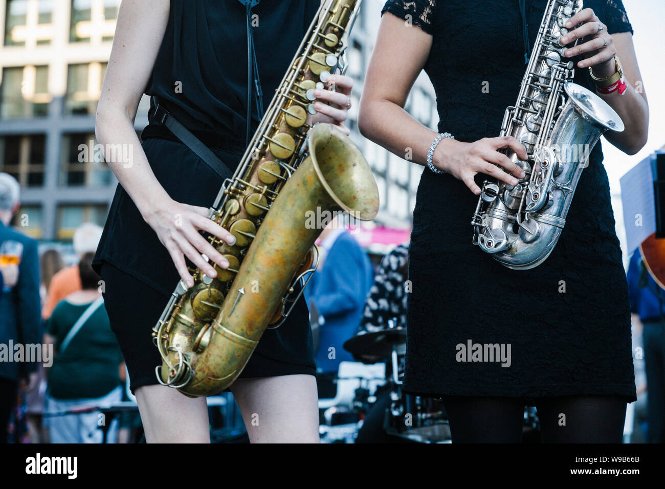 Woman outside playing a saxophone hi-res stock photography and images ...