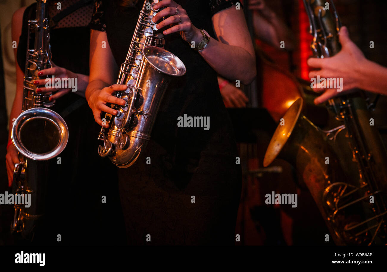 Young woman in black saxophone hi-res stock photography and images - Alamy