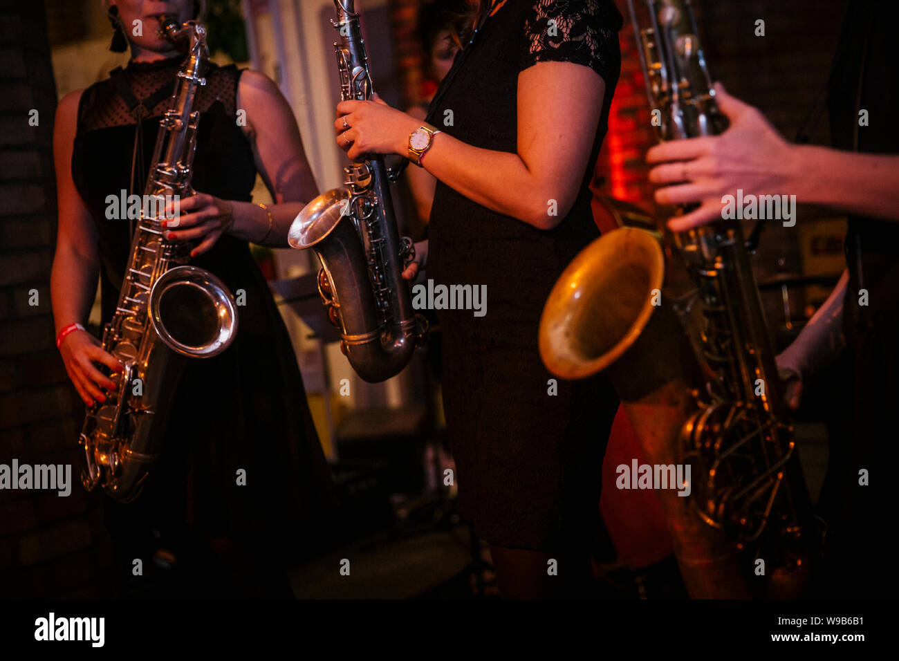 Young woman in black saxophone hi-res stock photography and images - Alamy