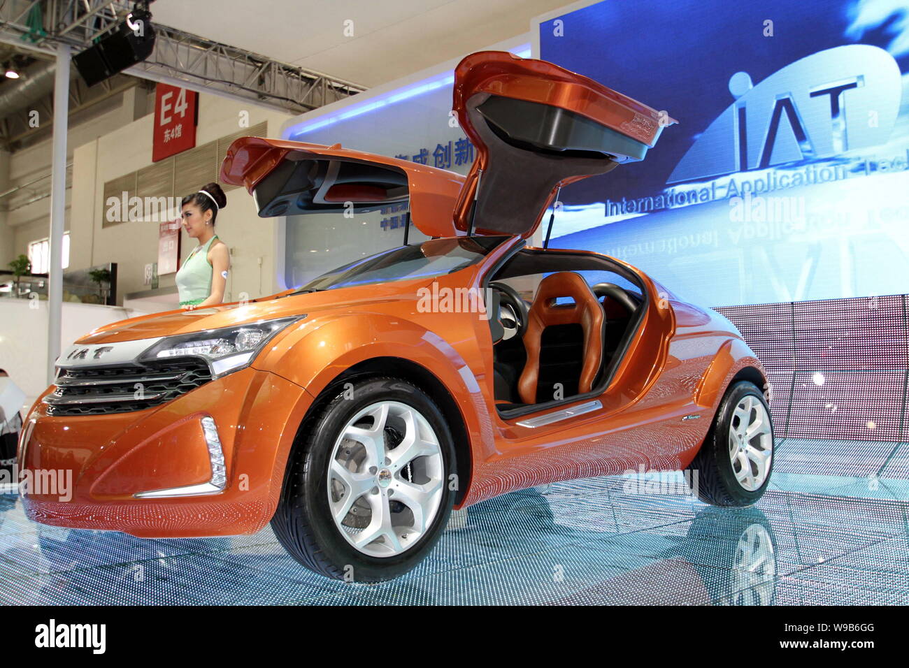 A model poses next to the IAT Cross Wind II EV Concept at the 11th ...