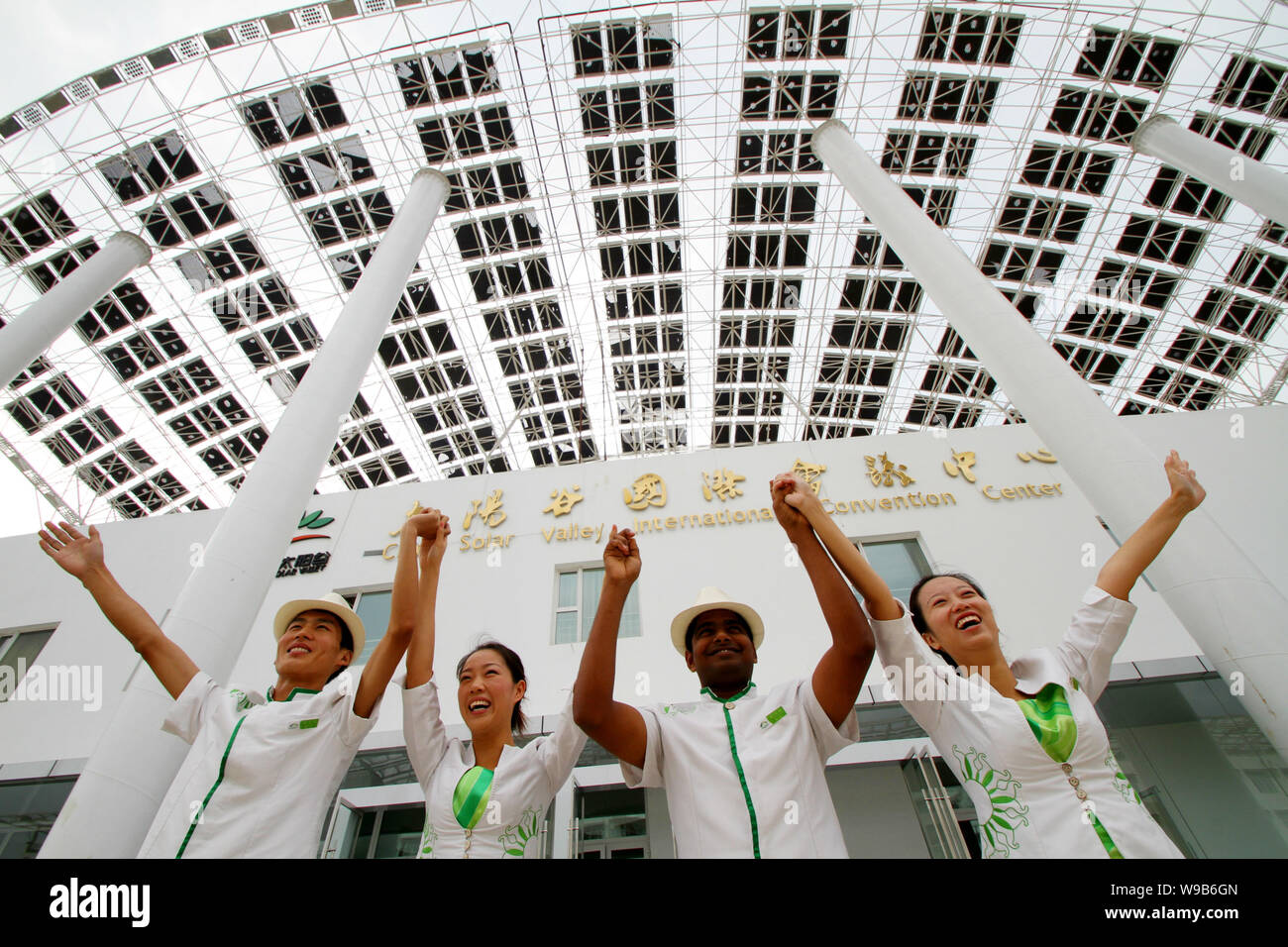 Attendants celebrate in front of the China Solar Valley International ...