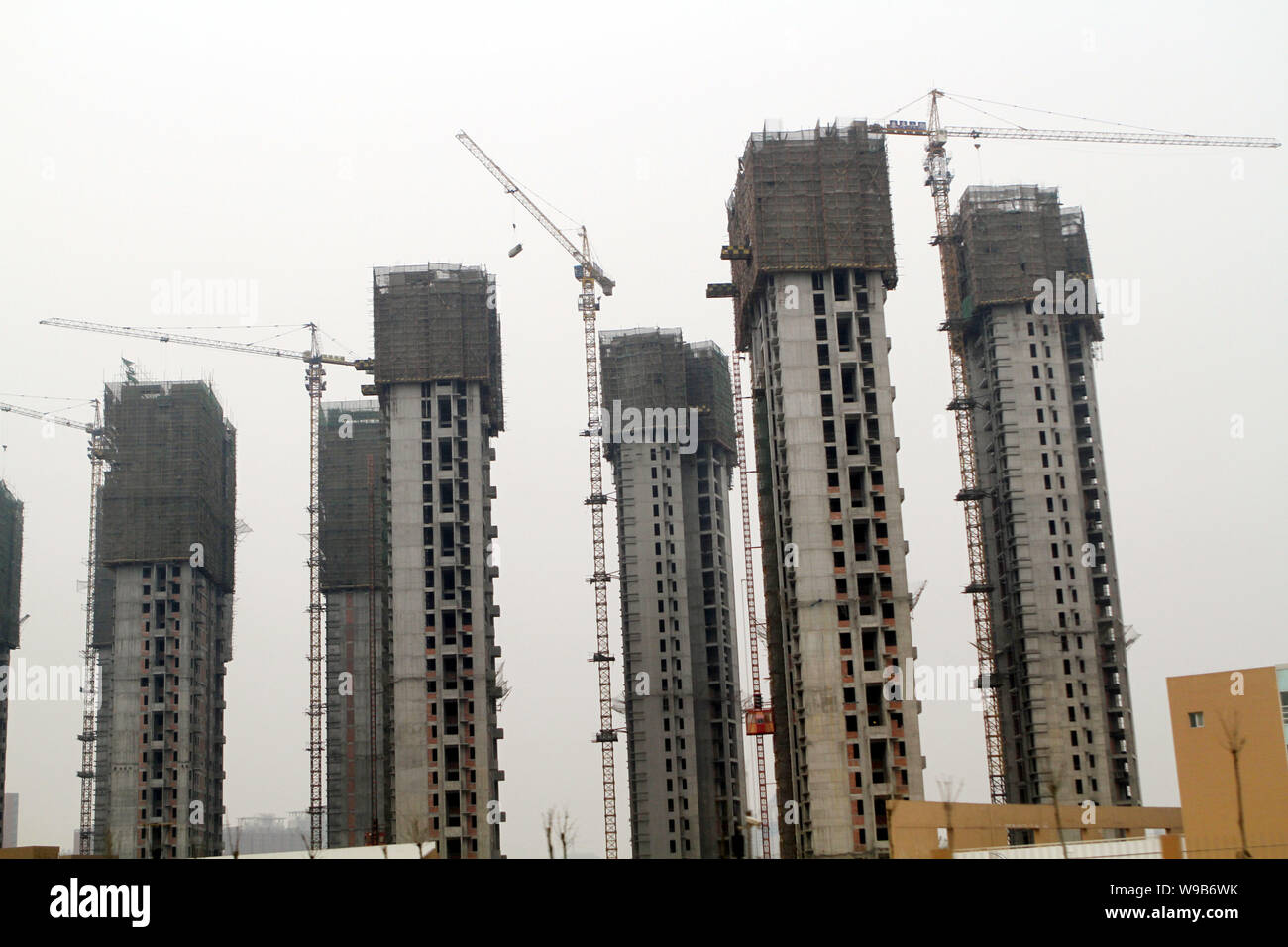Residential apartment buildings are under construction in the Sino ...