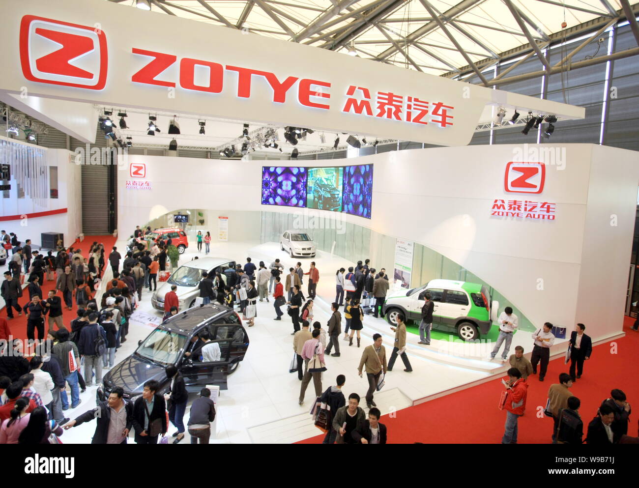 --FILE--Visitors look at cars of Zotye Auto at the 13th Shanghai ...