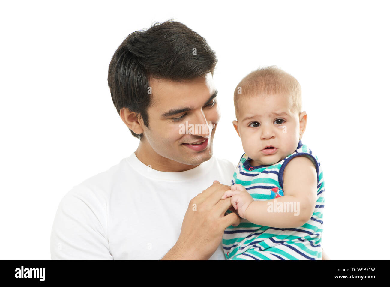 Young man carrying his baby Stock Photo - Alamy