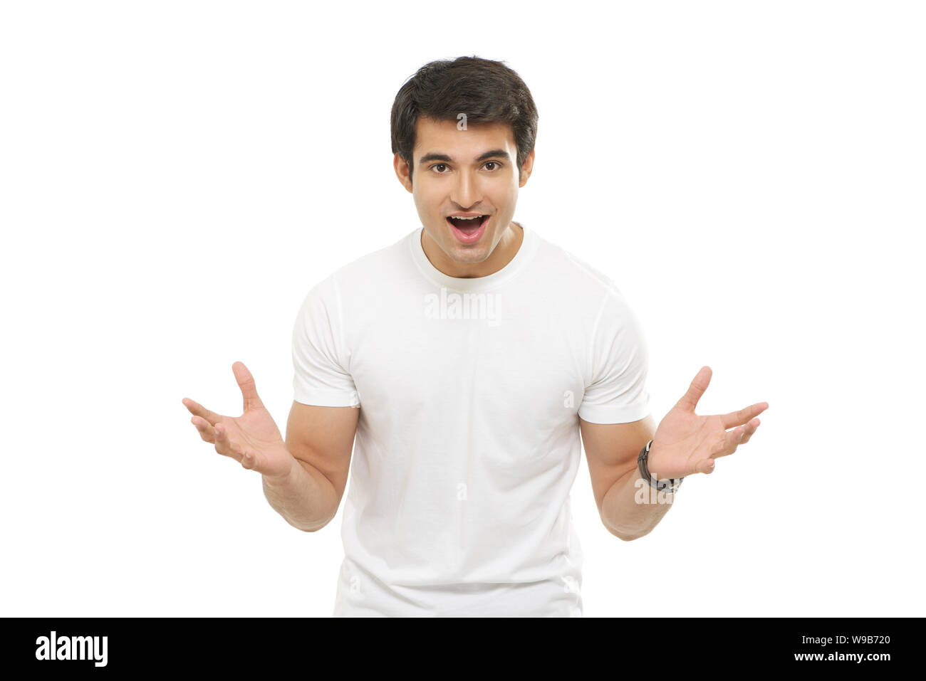 Young man looking surprised Stock Photo - Alamy