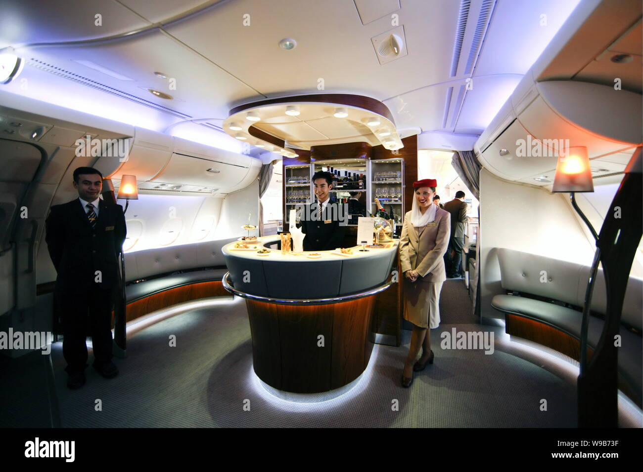 Emirates staff are seen in an Airbus A380 at Beijing Capital ...