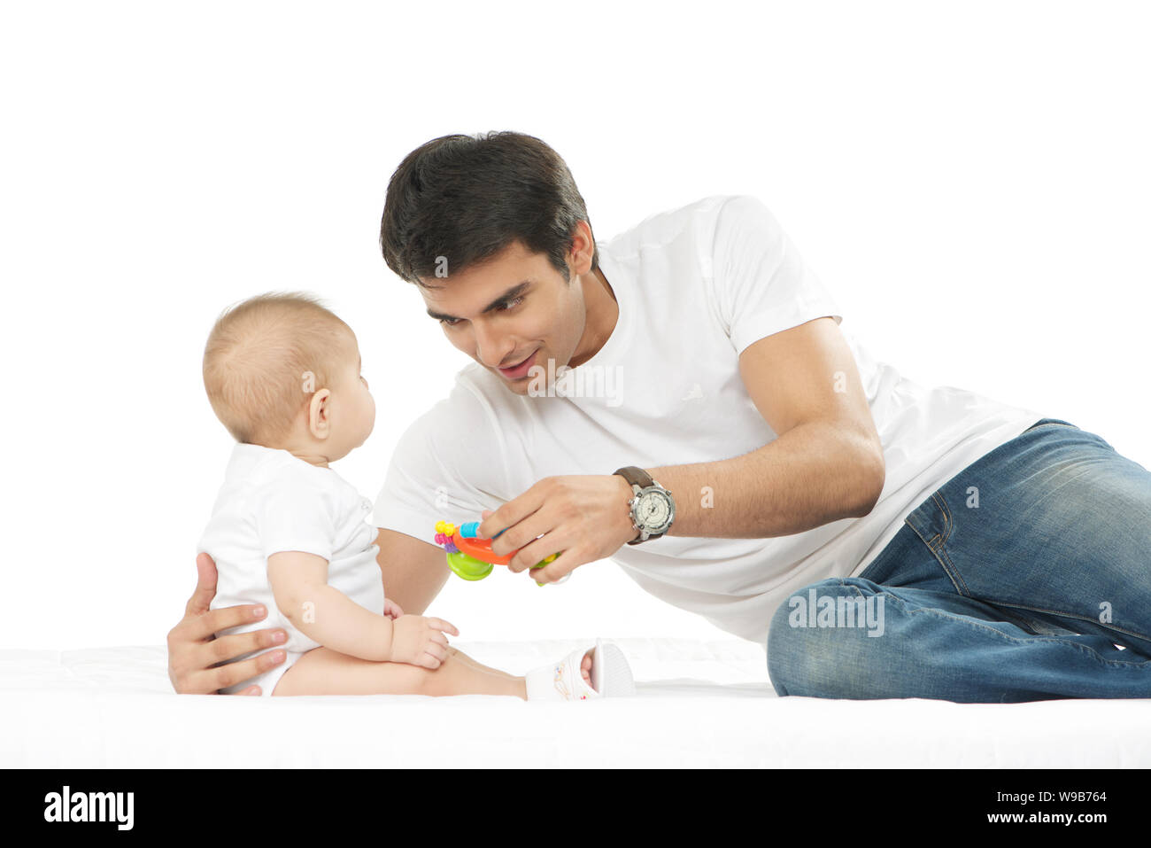 Young man playing with his baby Stock Photo - Alamy