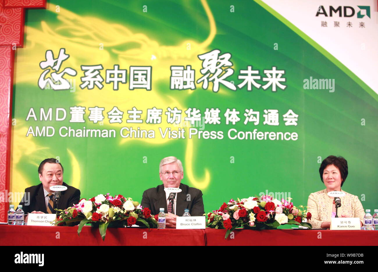 Bruce Claflin (center), Chairman of the Board of Advanced Micro Devices ...