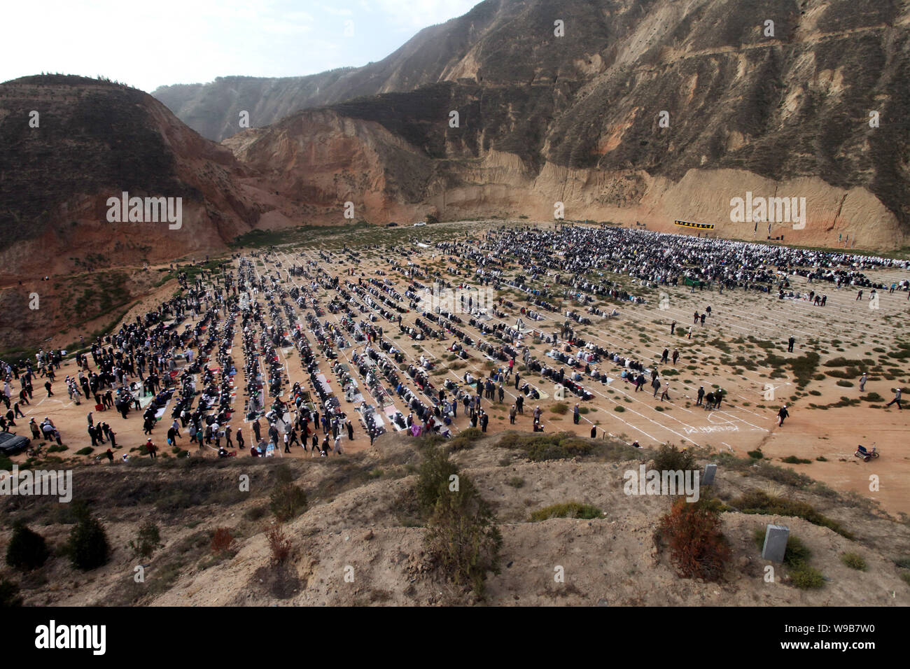 Chinese Muslims attend a prayer session during the Eid al-Fitr on the ...
