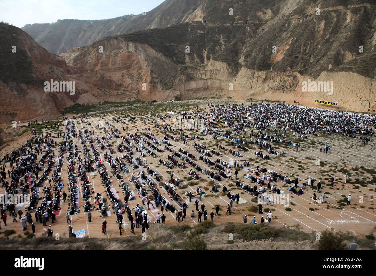 Chinese Muslims attend a prayer session during the Eid al-Fitr on the ...