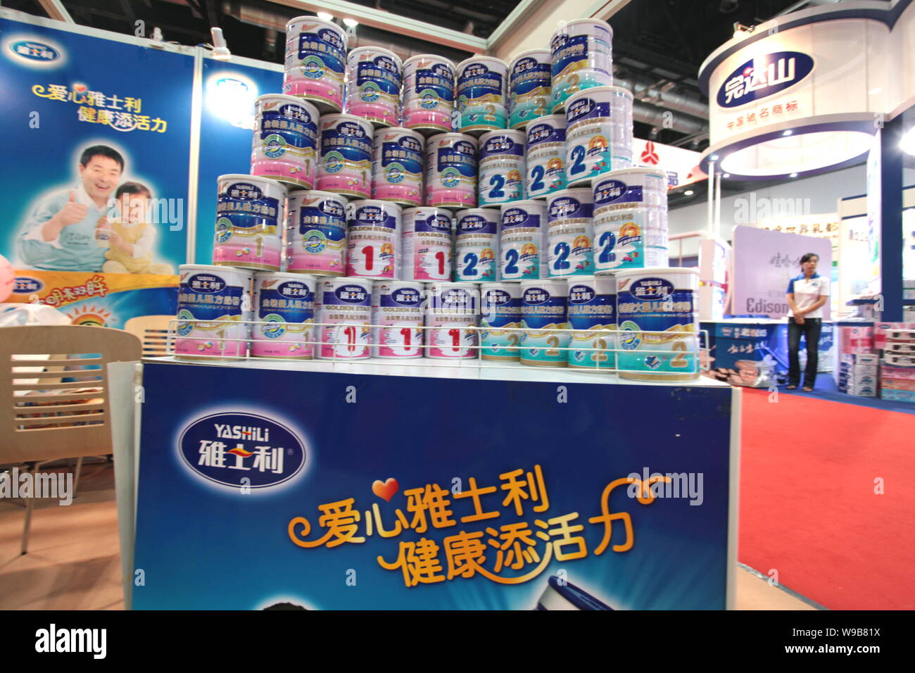 Tins of Yashili baby formula are seen for sale at the stand of Yashili ...