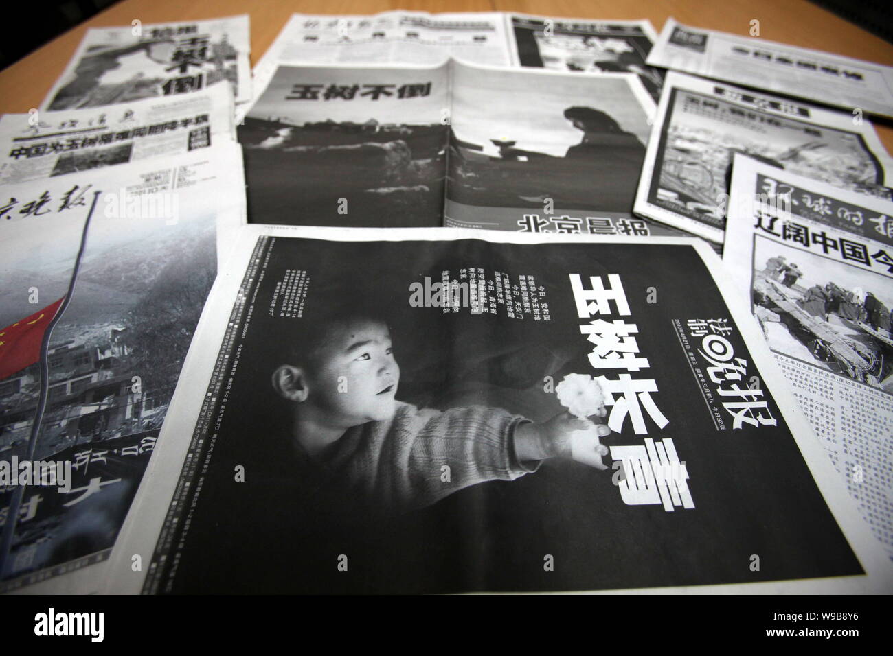 View of Chinese newspapers printed in black and white to mourn for the ...