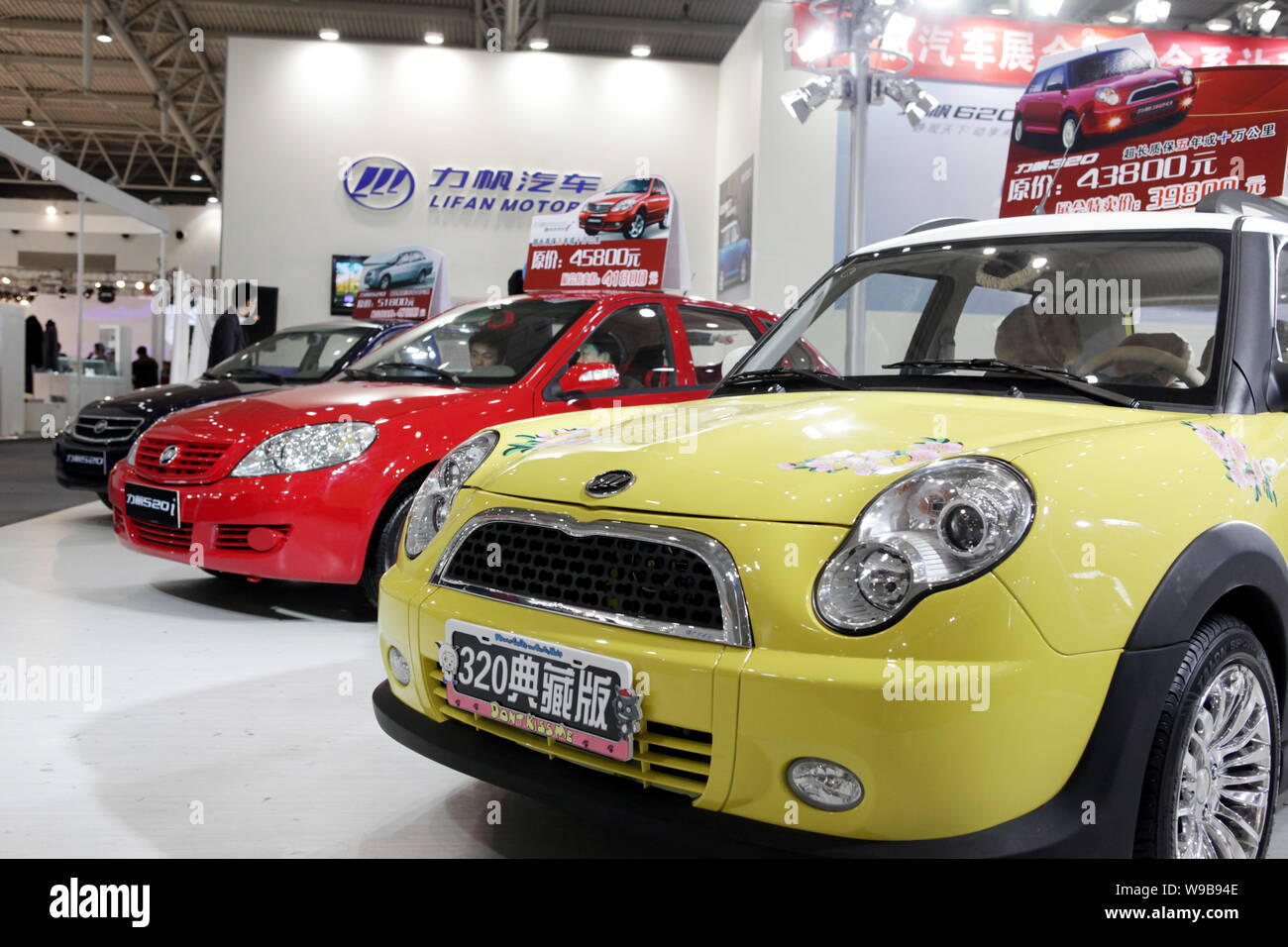 A Lifan 320 and other Lifan cars are displayed during an auto show in ...