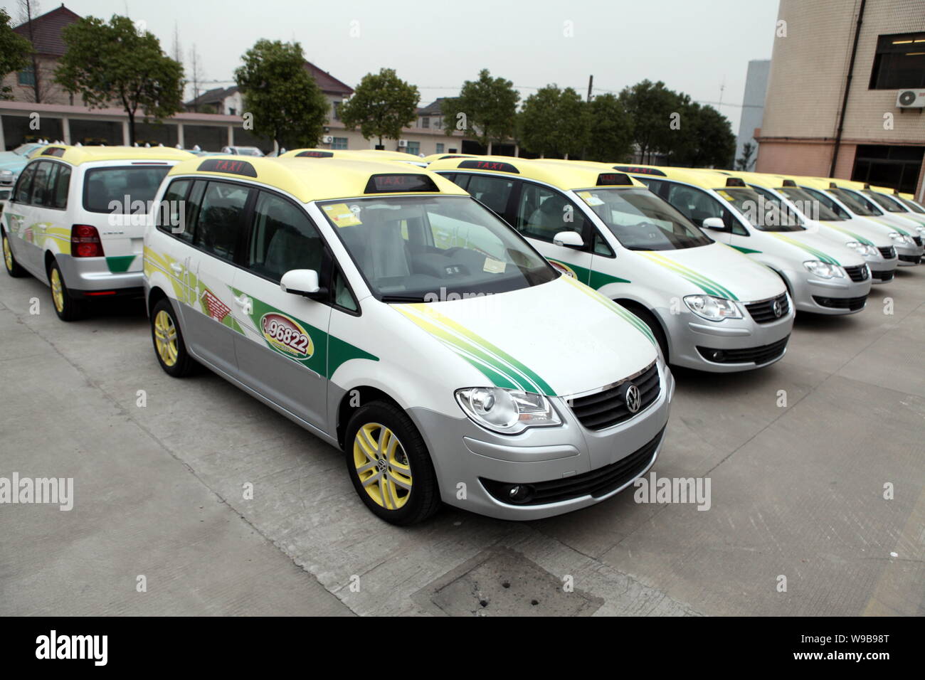 Volkswagen Touran taxis for the Expo 2010 are lined up at a parking lot ...