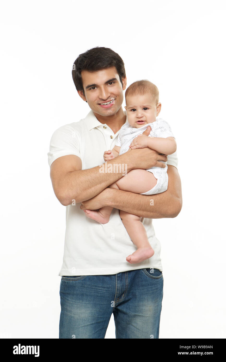Indian man holding baby daughter hi-res stock photography and images ...