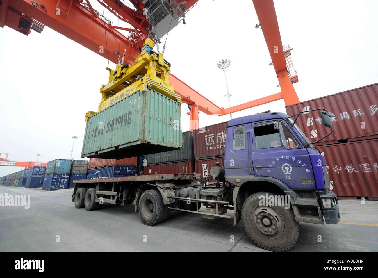 --FILE--A container crane unloads a truck at the Chengdu Railway ...