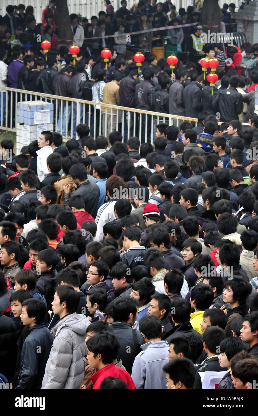 Crowds of job seekers queue up to apply for jobs during a recruitment ...