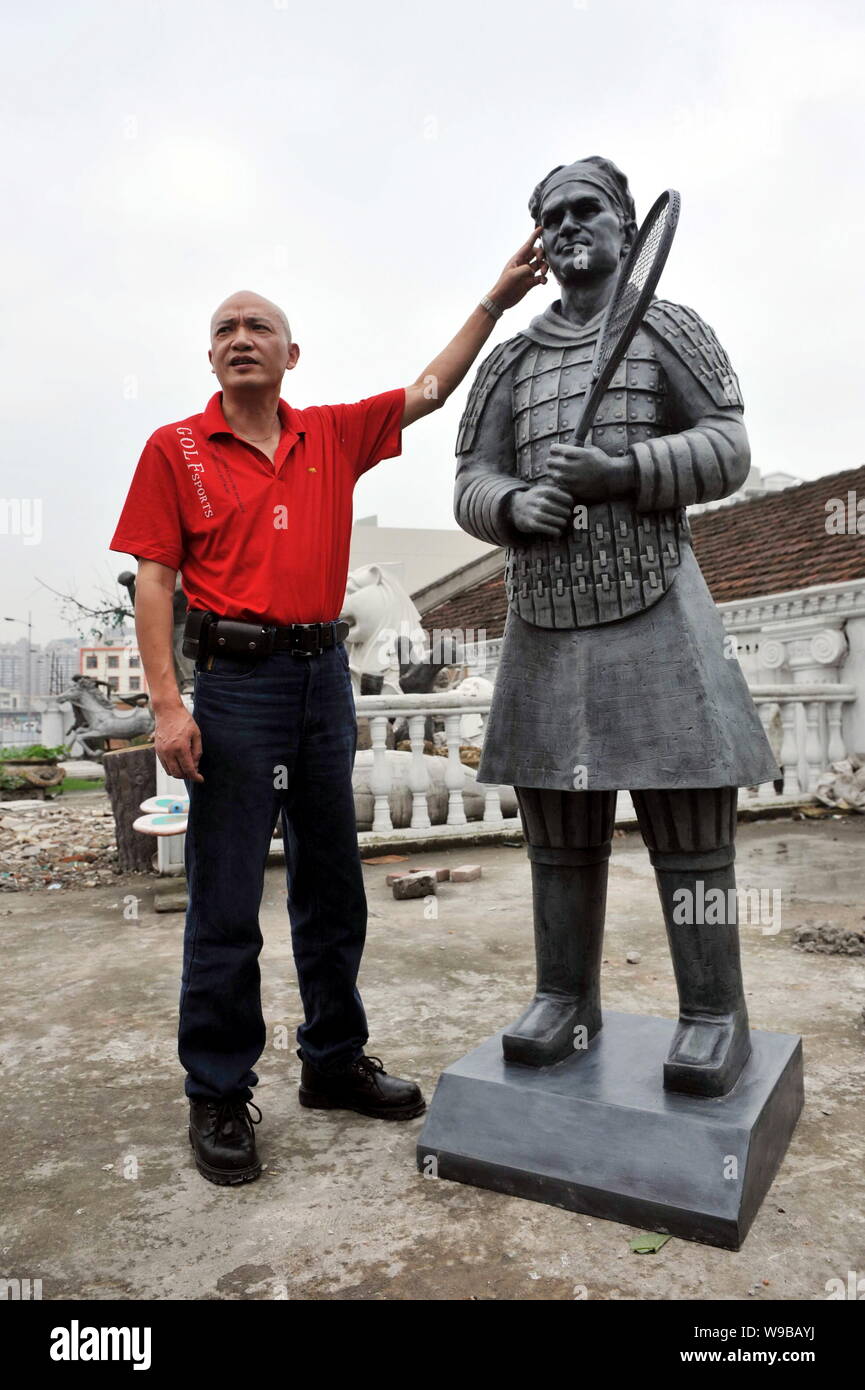 Chinese sculptor Chen Haiyan speaks to the press next to the terracotta ...