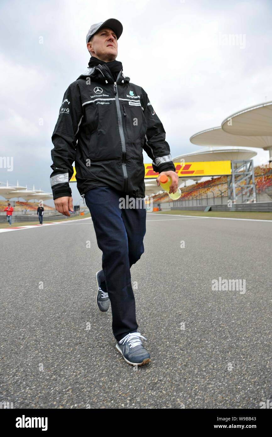 German F1 driver Michael Schumacher of Mercedes GP team walks on the ...