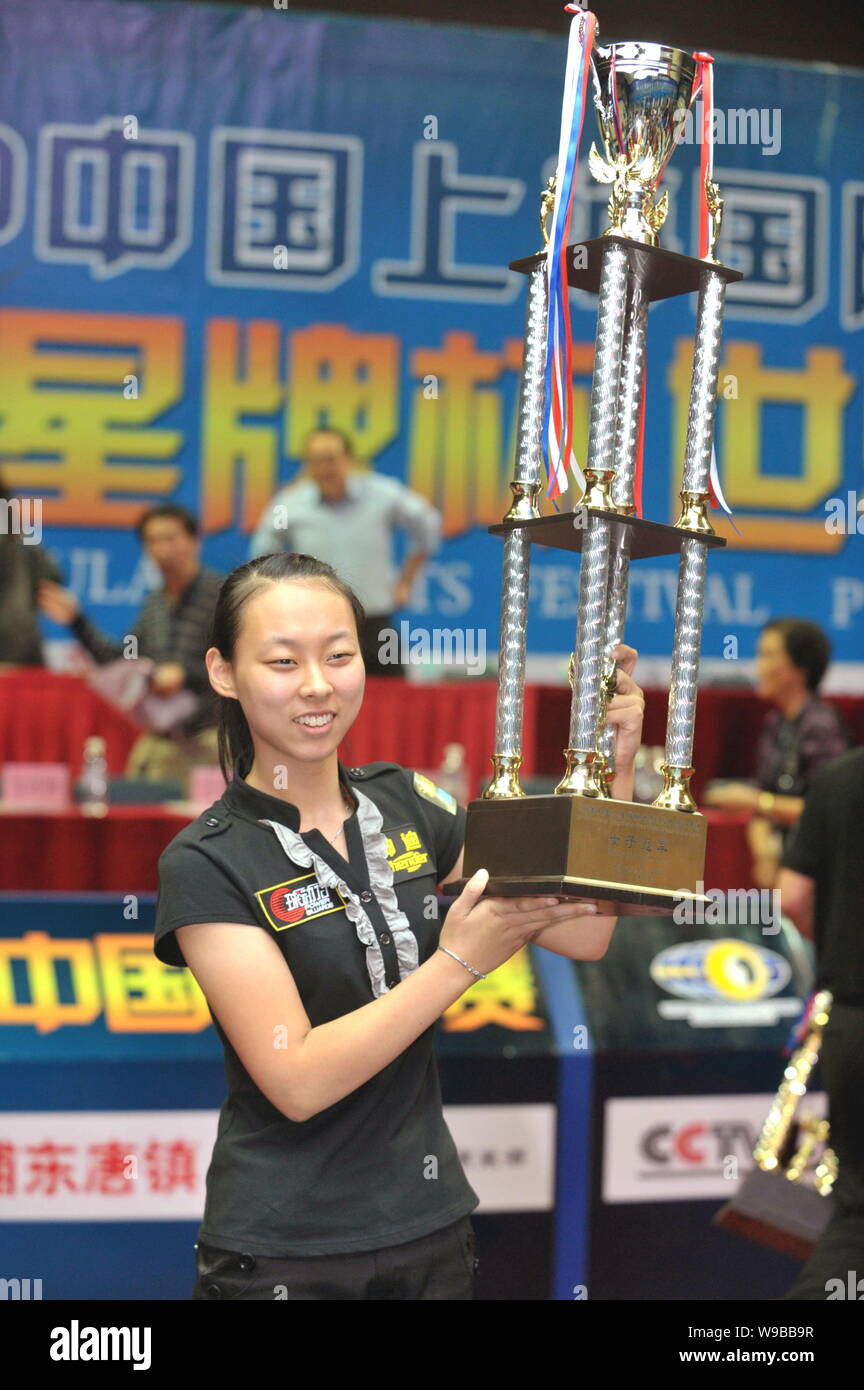Chinas Chen Siming poses with the trophy after winning the womens ...