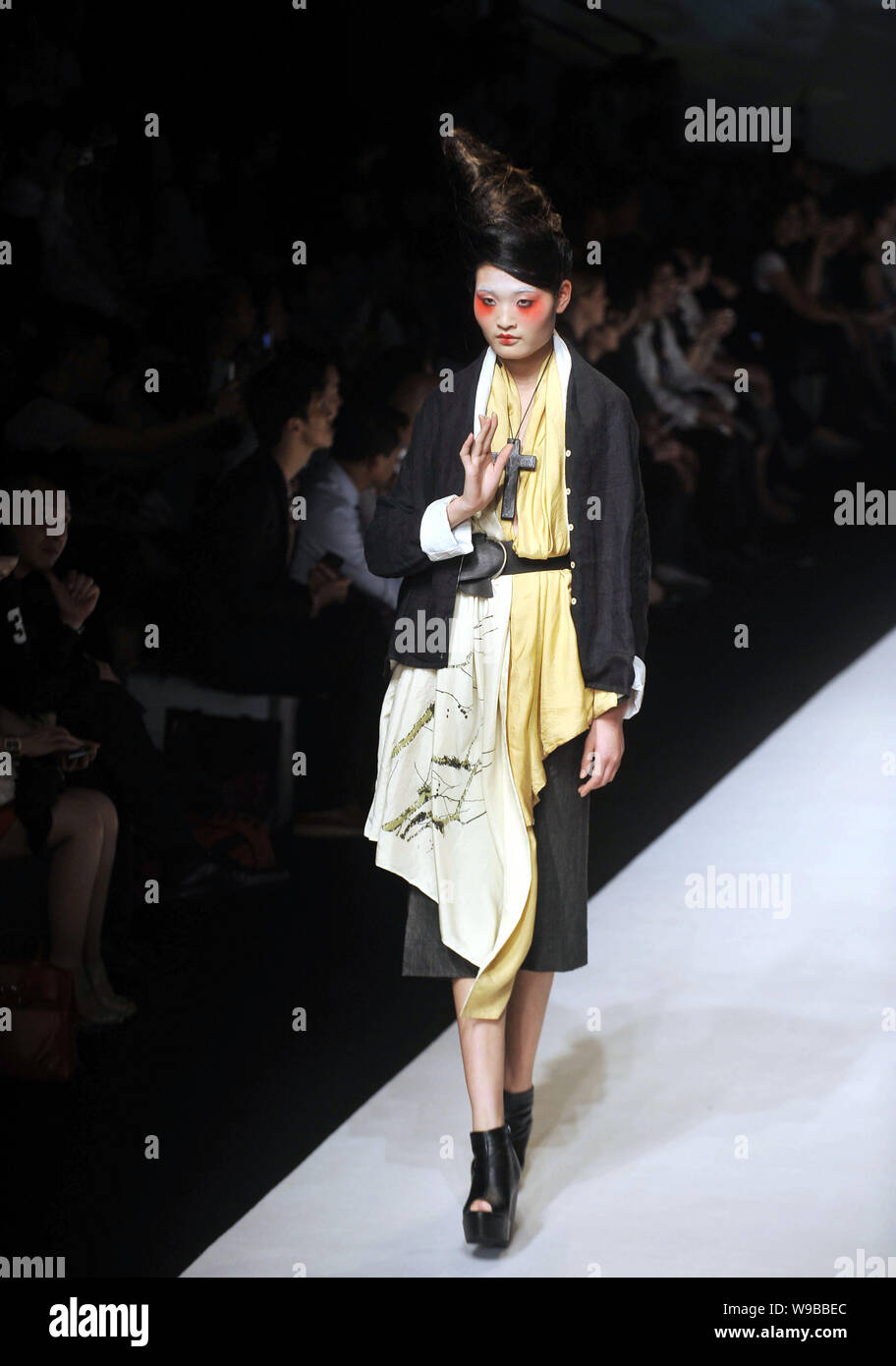 A model parades to show the new collections in the Seven Days fashion ...