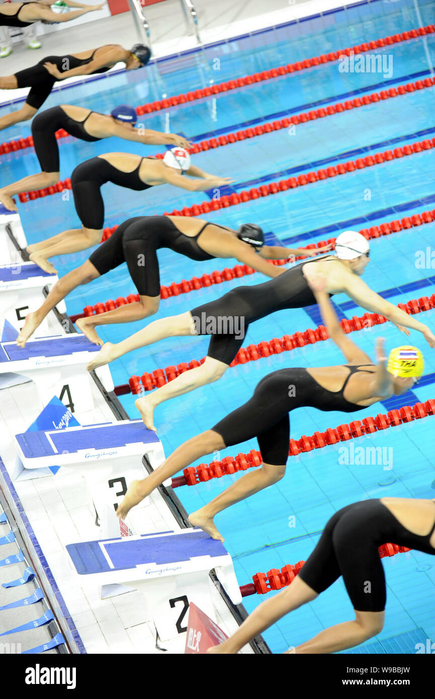 Swimmers compete in the womens 4x100m freestyle relay final at the 16th ...