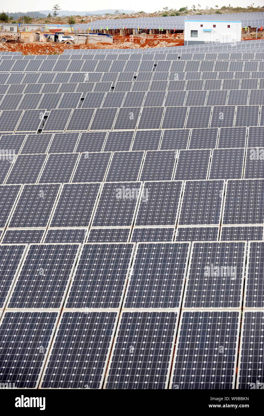 View of arrays of photovoltaic panels at the Kunming Shilin Solar Power ...