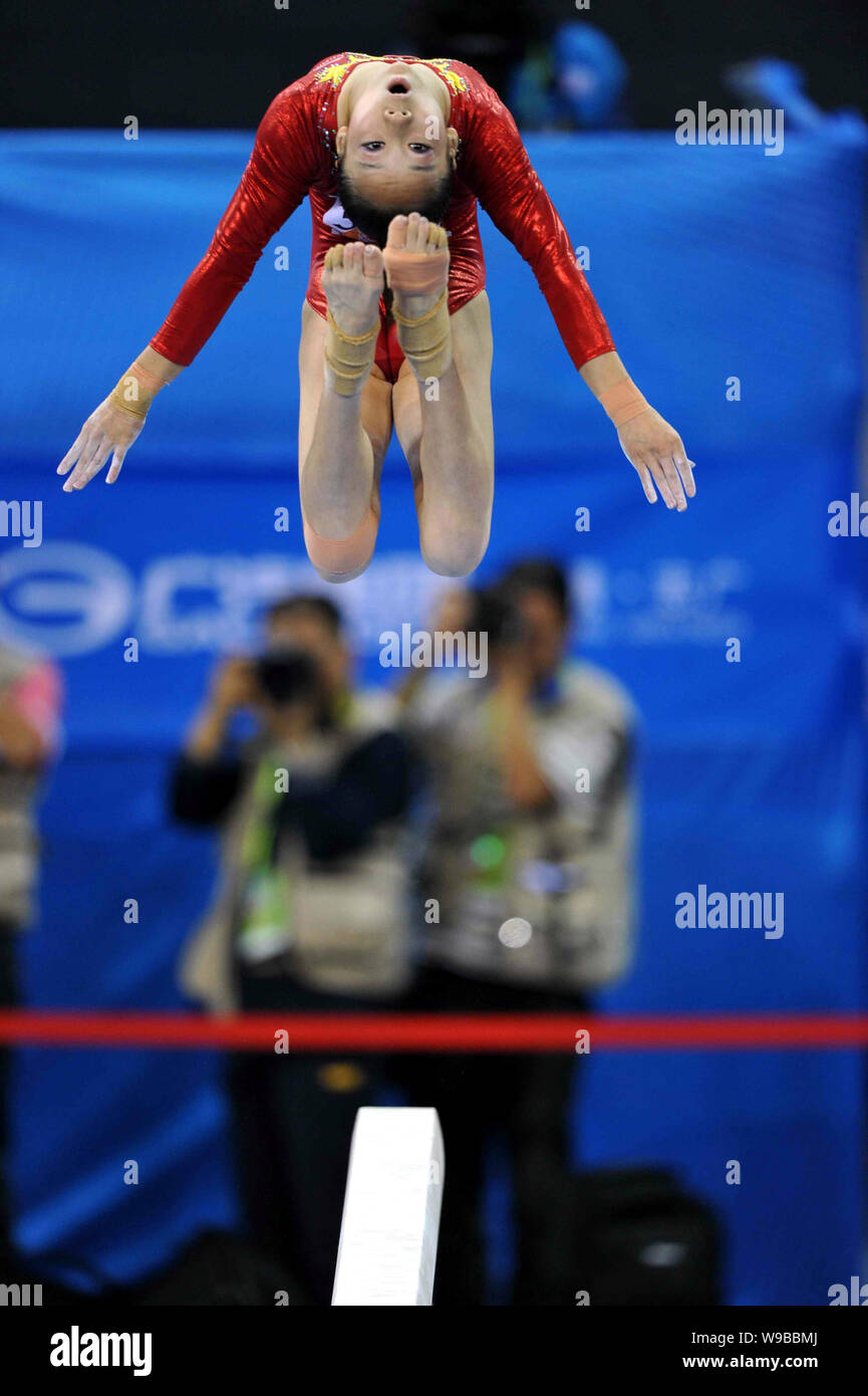 Chinas Deng Linlin performs on the balance beam during the Womens ...