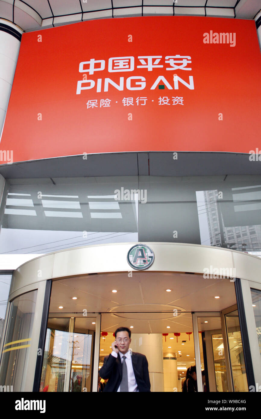 --FILE-- A Chinese man leaves a branch of Ping An of China in Shanghai ...