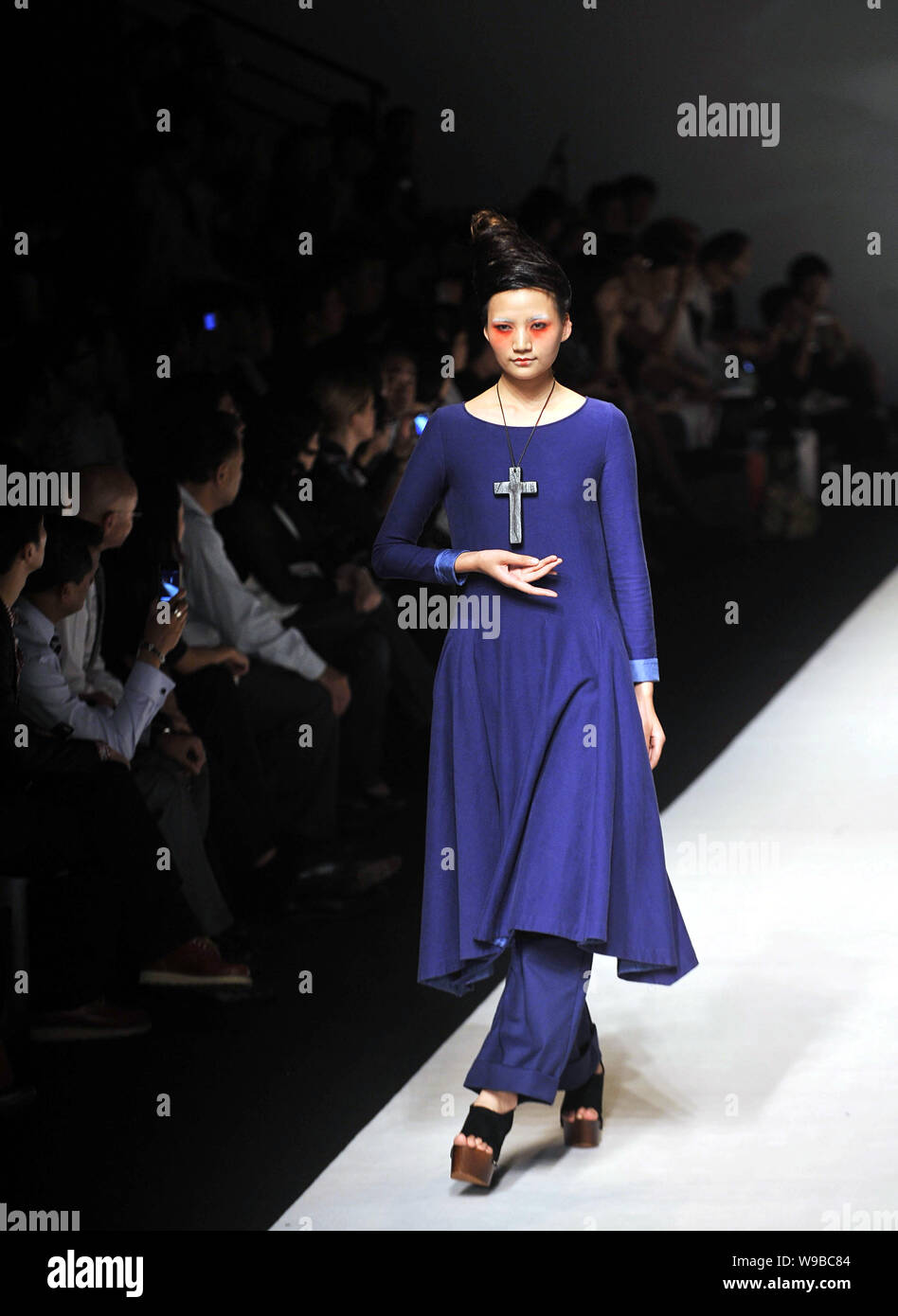 A model parades to show the new collections in the Seven Days fashion ...