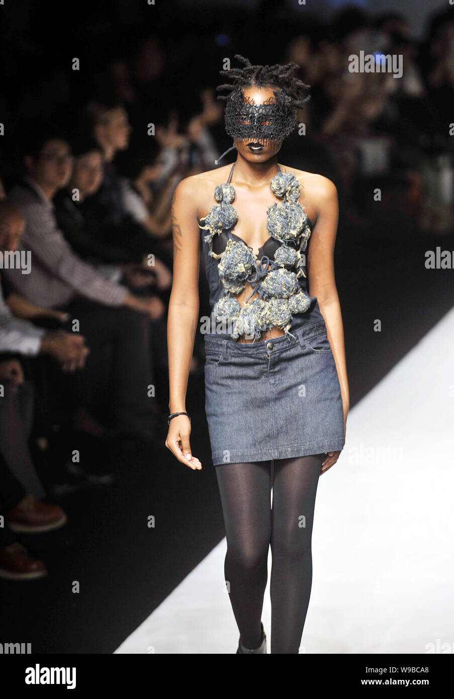 A model parades to show the new collections in the Seven Days fashion ...