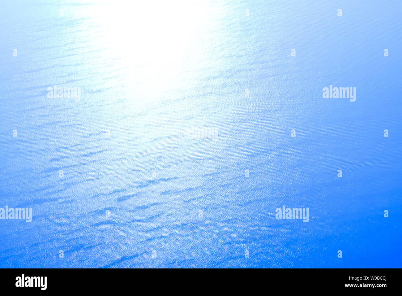Blue color concept: Sun light and abstract sea waves nature background ...