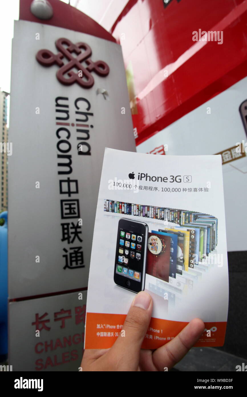 A Chinese man shows a pamphlet of Apple iPhone 3GS outside a branch of ...