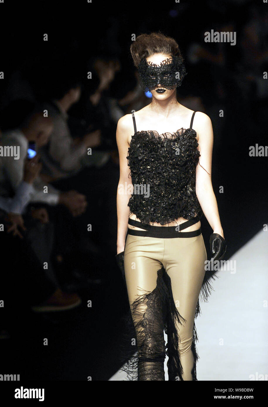 A model parades to show the new collections in the Seven Days fashion ...