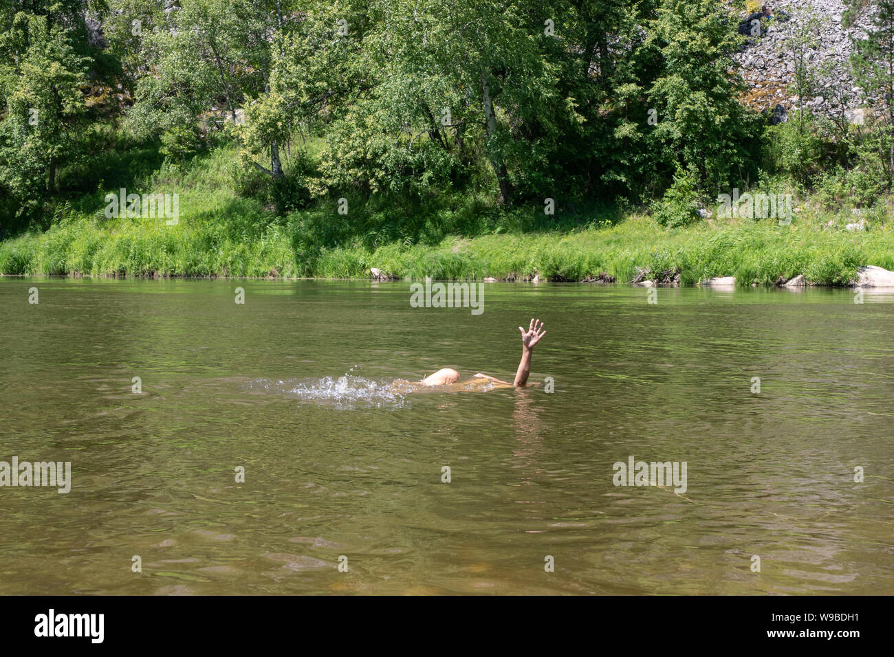 drowning man trying to get out of the water. drowning in the river ...