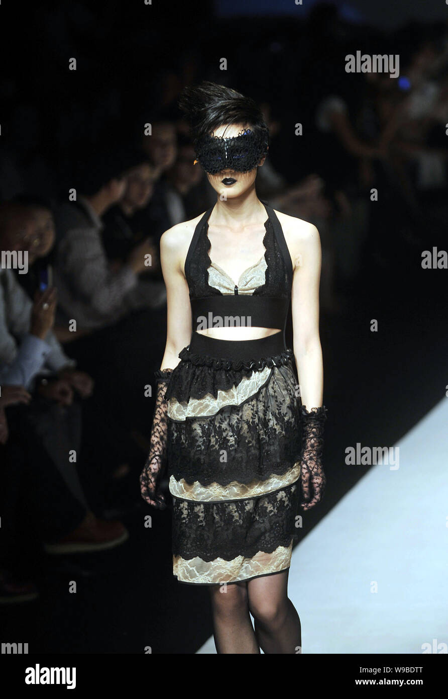 A model parades to show the new collections in the Seven Days fashion ...