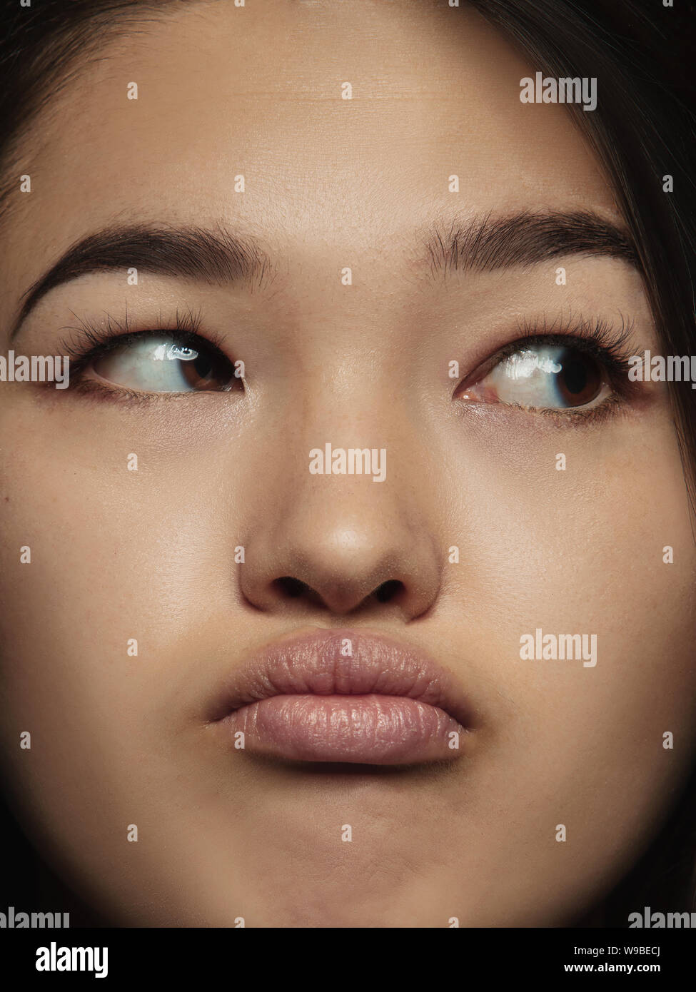 Close up portrait of young and emotional chinese woman. Highly detail ...